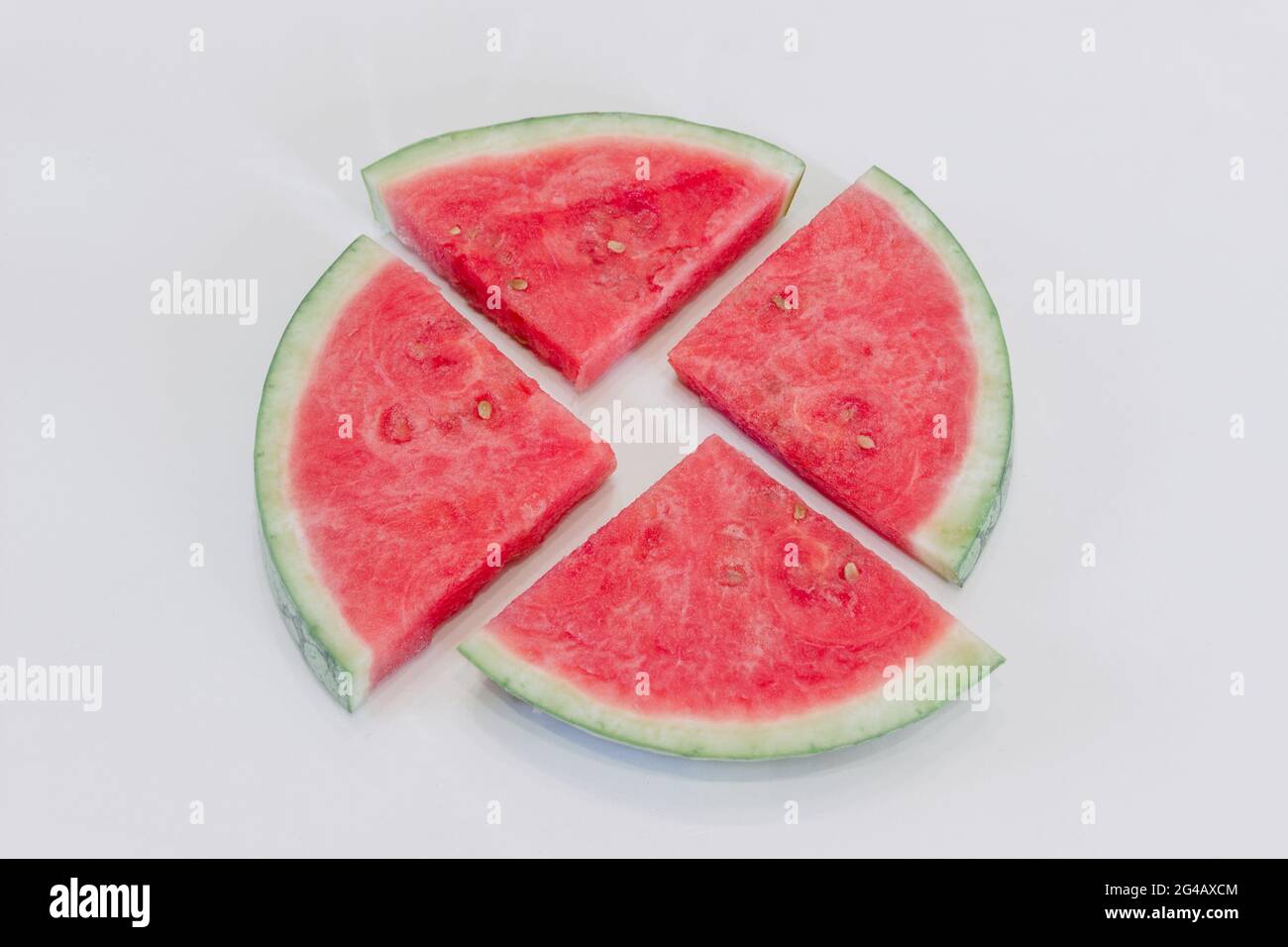 Slices of watermelon in the shape of a triangle on a white background ...
