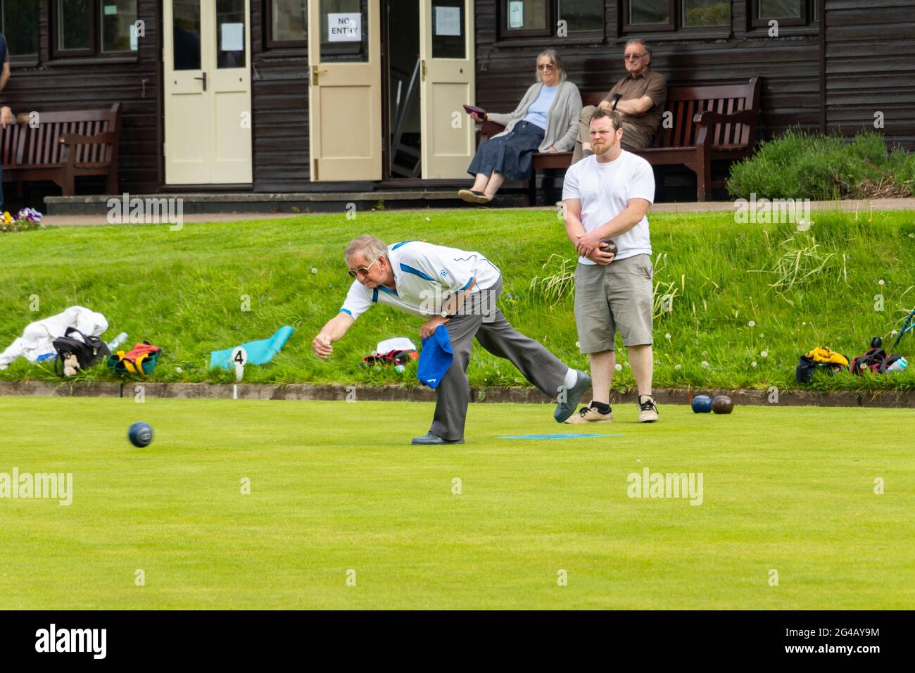 man bowls in local match of lawn bowls on the green in Hexham ...