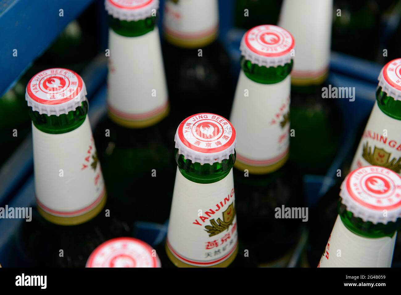 Bottles of Yanjing beer, Beijing's famous brew, in a crate outside a ...