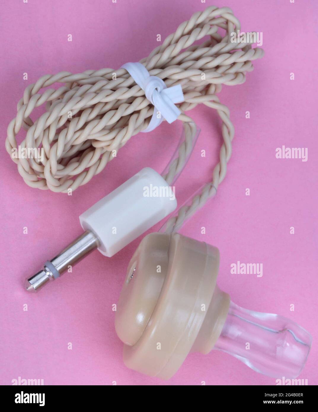 Plastic Headphones on Pink Background Stock Photo - Alamy