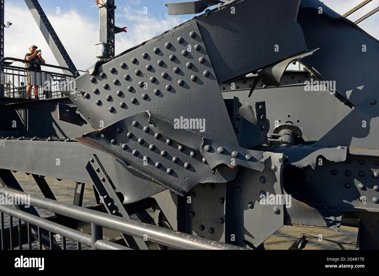 Damaged section of the old, bomb-damaged, bridge across the Yalu river ...