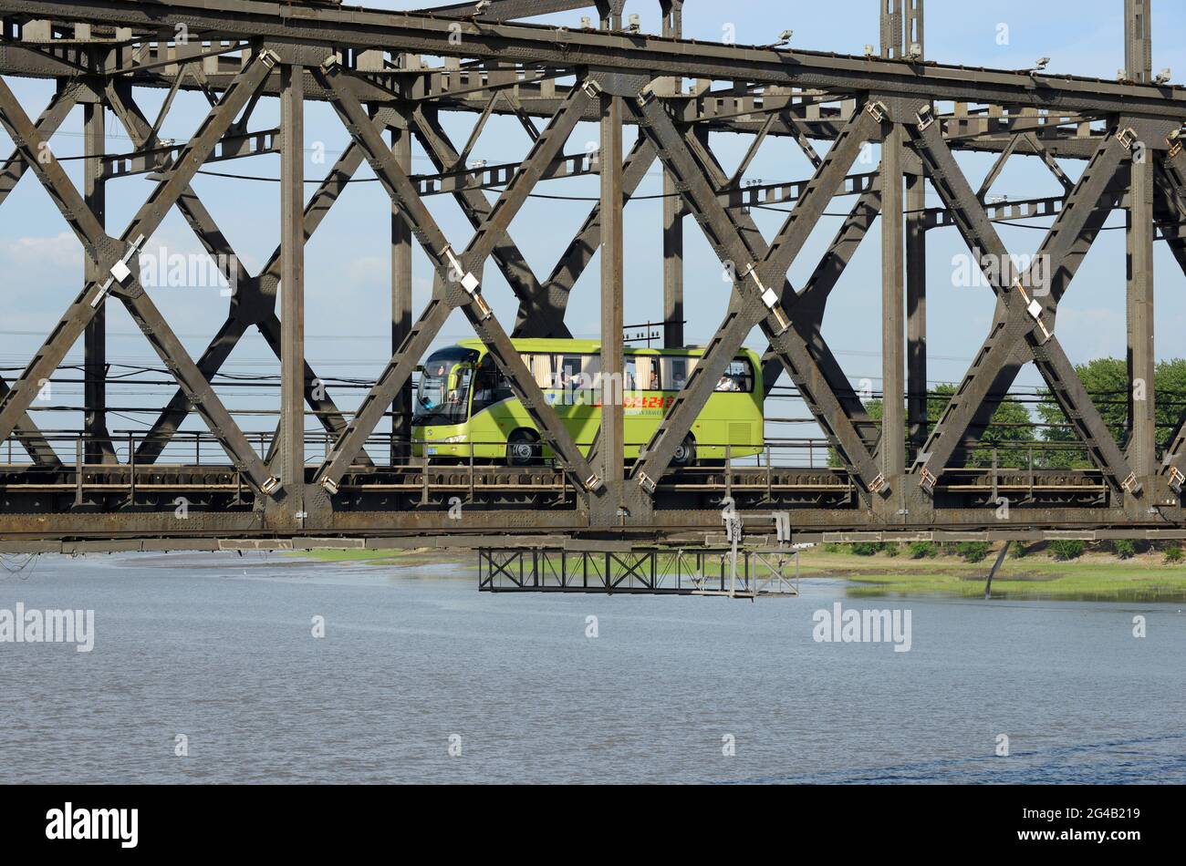 A bus from North Korea crosses the Sino-Korea friendship bridge which ...