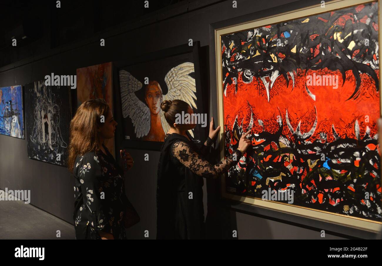 Pakistani visual artist Amna Butt gives tour to guests of her visual art hand made - painting ...