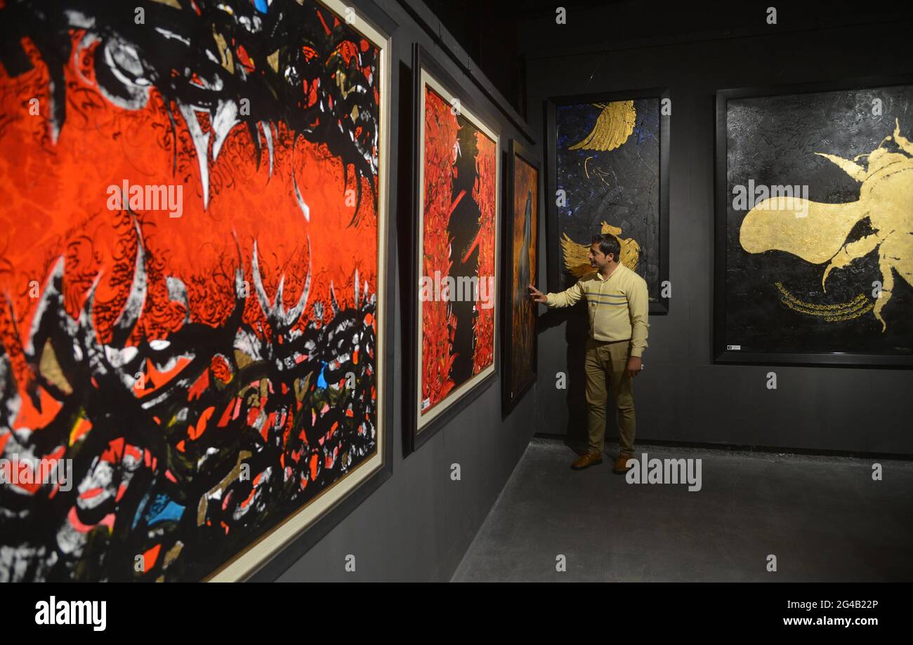 Pakistani visual artist Amna Butt gives tour to guests of her visual art hand made - painting ...