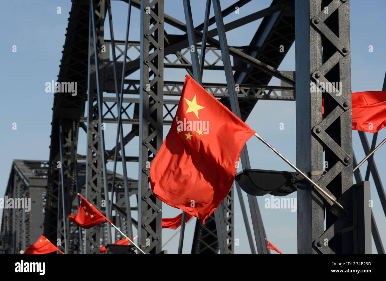 View of the old, bomb-damaged, bridge across the Yalu river between ...