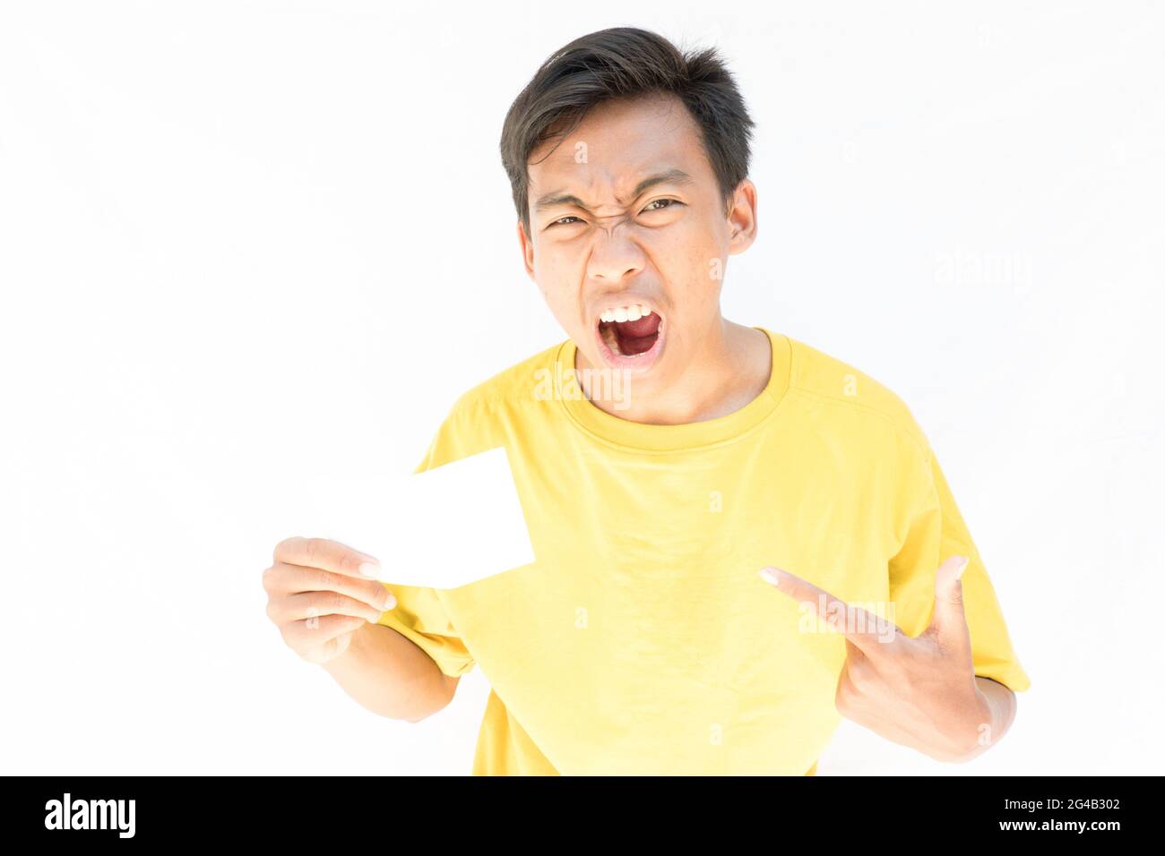 An Indonesian guy pointing to a piece of paper and screaming on a white ...