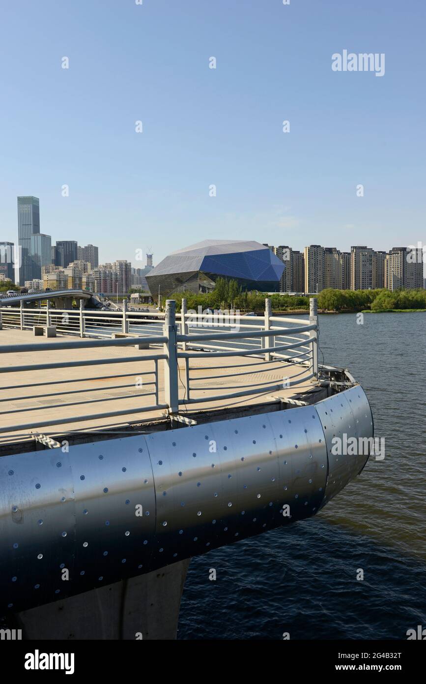 View of the unusually-shaped Shengjing Grand Theater on the north bank ...