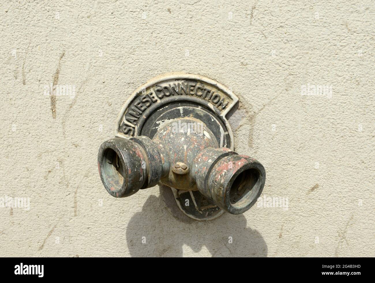 A Siamese connection on a wall in Shenyang city, China, presumably left ...
