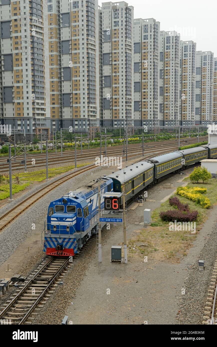A locomotive shunts a train of carriages from the sidings to the ...