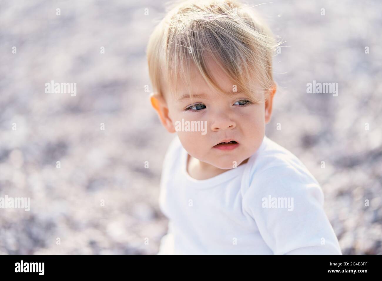 Cute kid looks to the side. Portrait Stock Photo - Alamy