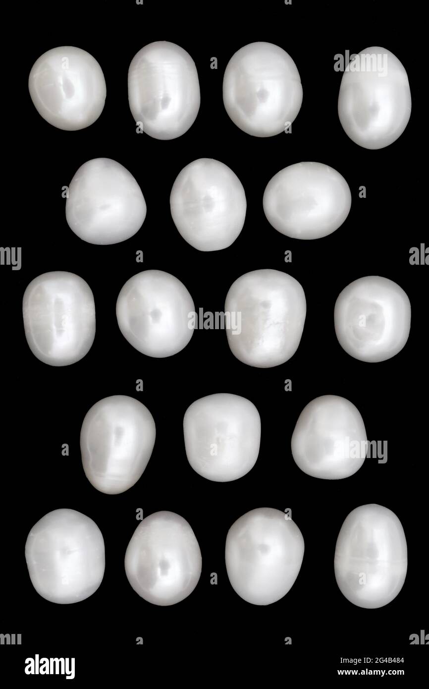 Pearl rare jewel stones texture on black background Stock Photo - Alamy