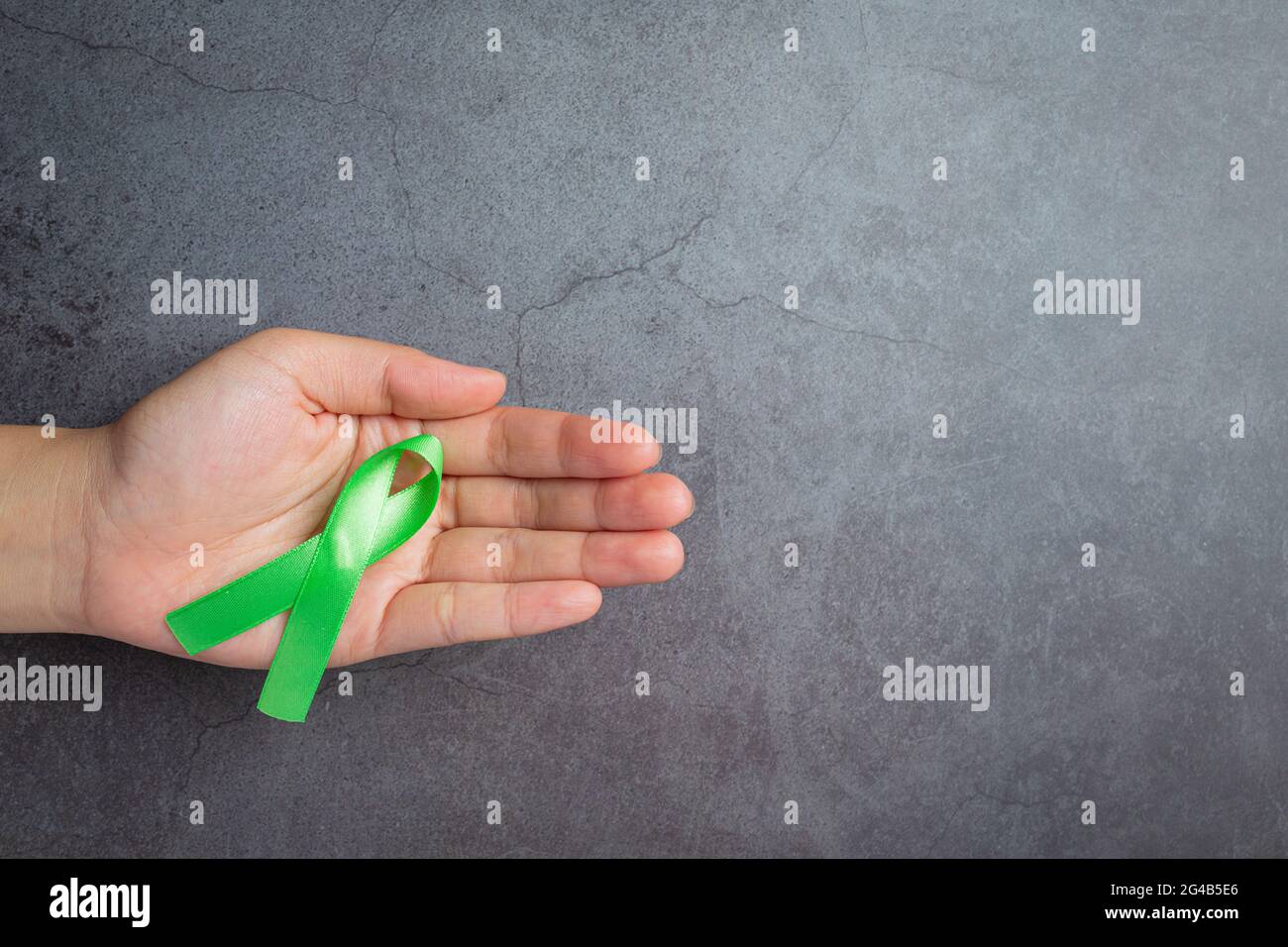 Green ribbon. Glaucoma awareness month Stock Photo - Alamy