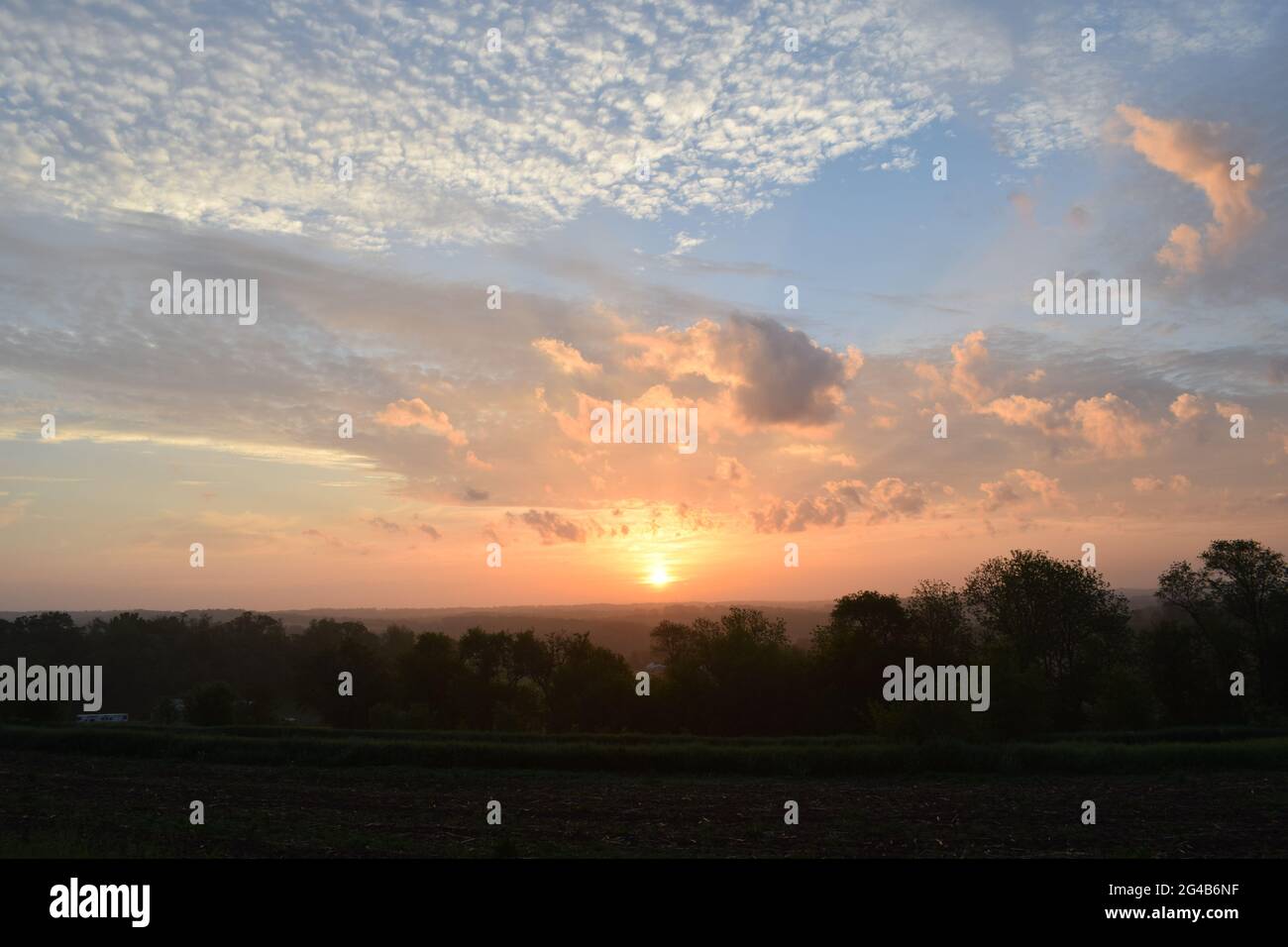 Sunrise with stratus clouds Stock Photo - Alamy