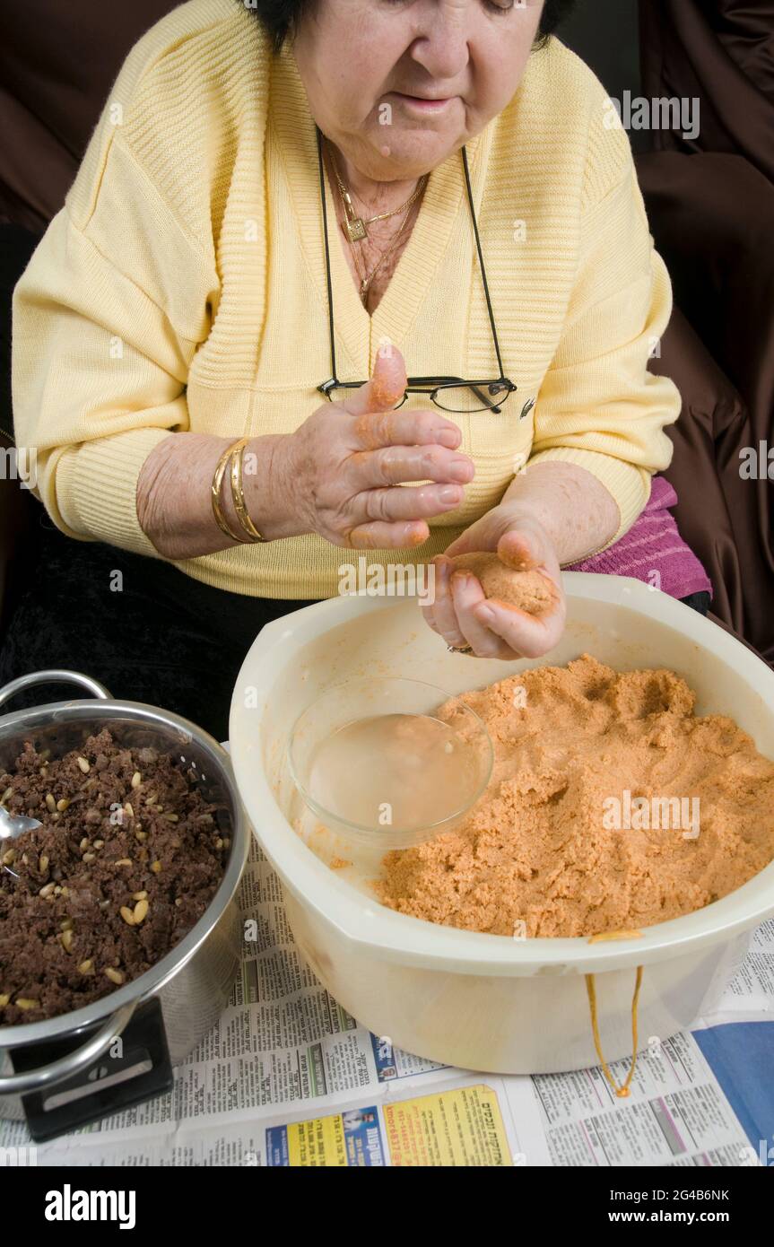 Preparing Kibbeh (Also Kibbe, Kubbah, Kubbeh) Burghul shell stuffed ...