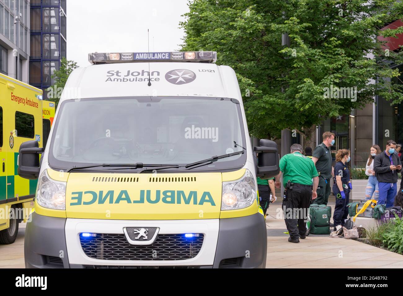 Medics from st johns ambulance and London ambulance services attend a ...
