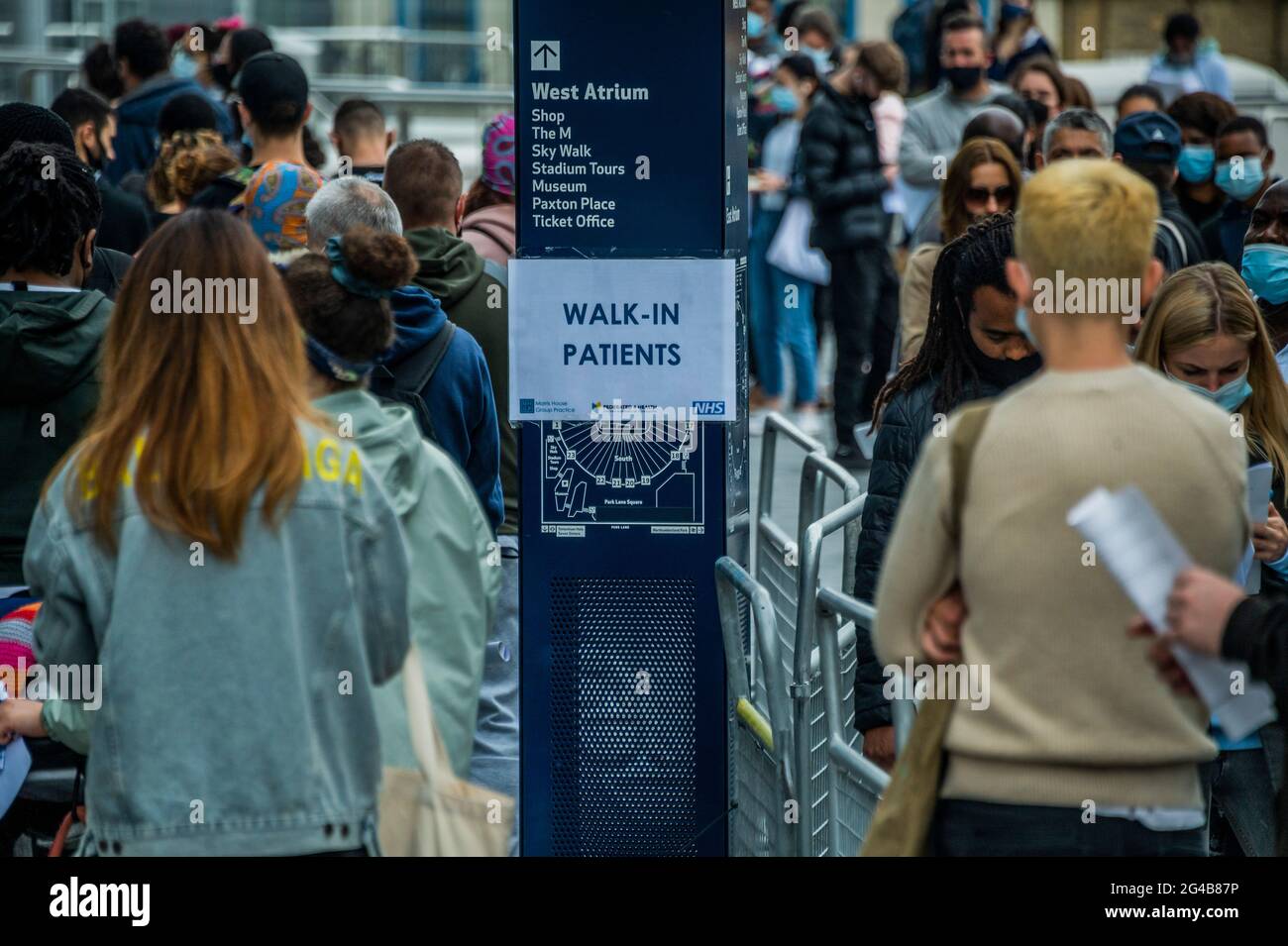 London, UK. 20th June, 2021. A steady walk-in queue outside - Mass ...