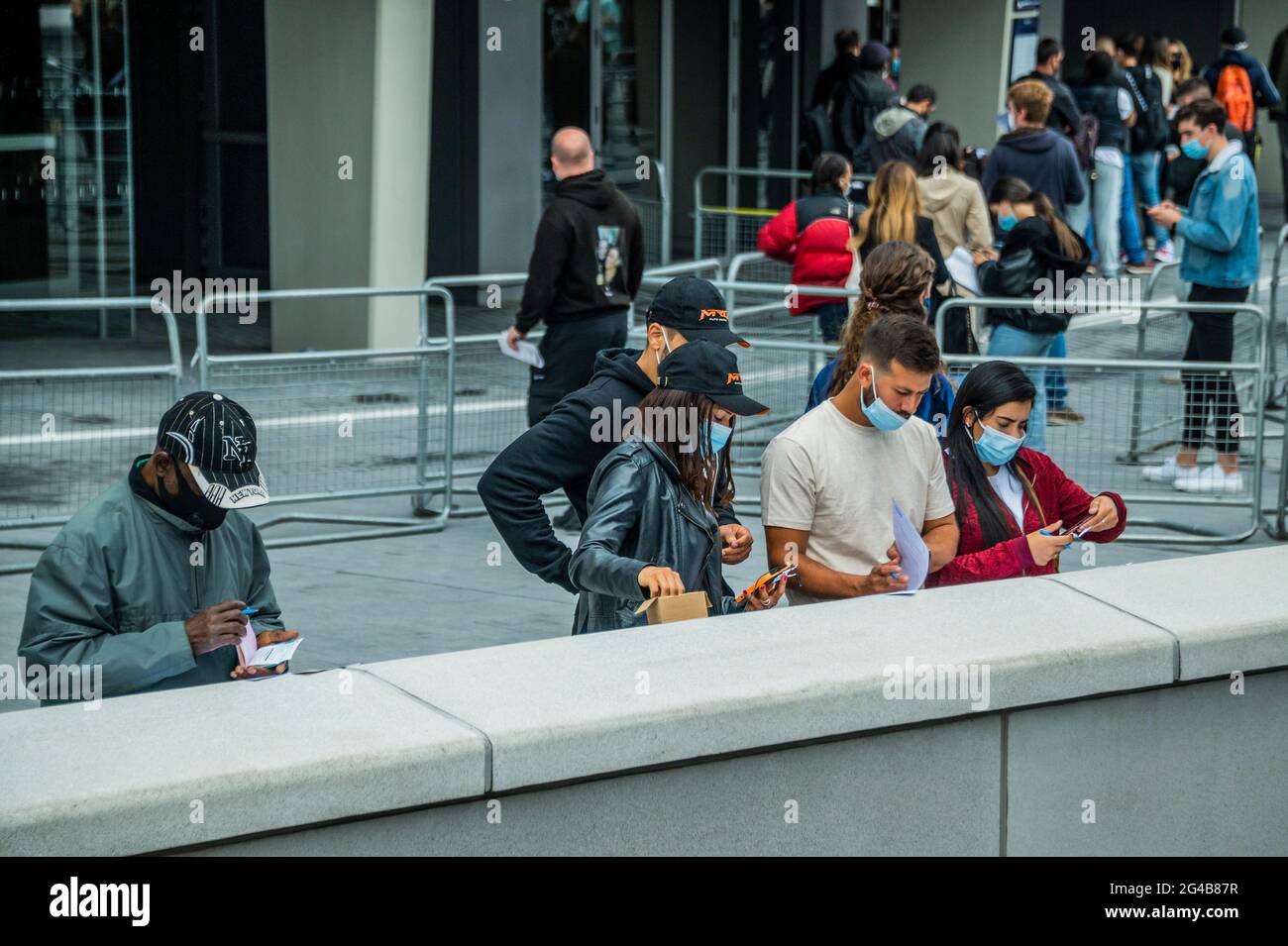 London, UK. 20th June, 2021. A steady walk-in queue outside - Mass ...