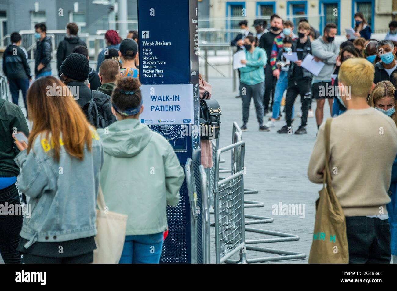 London, UK. 20th June, 2021. A steady walk-in queue outside - Mass ...