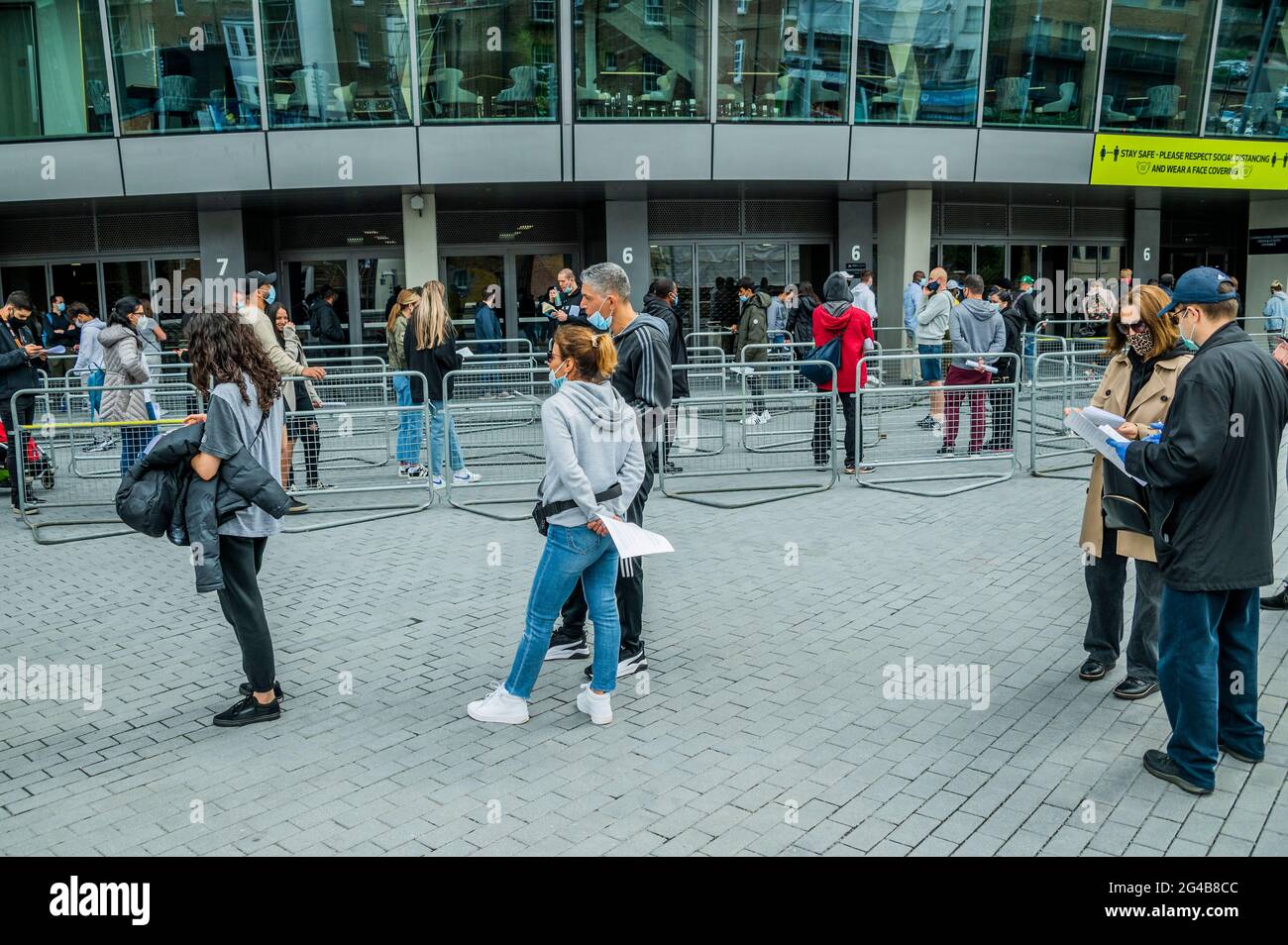 London, UK. 20th June, 2021. A steady walk-in queue outside - Mass ...