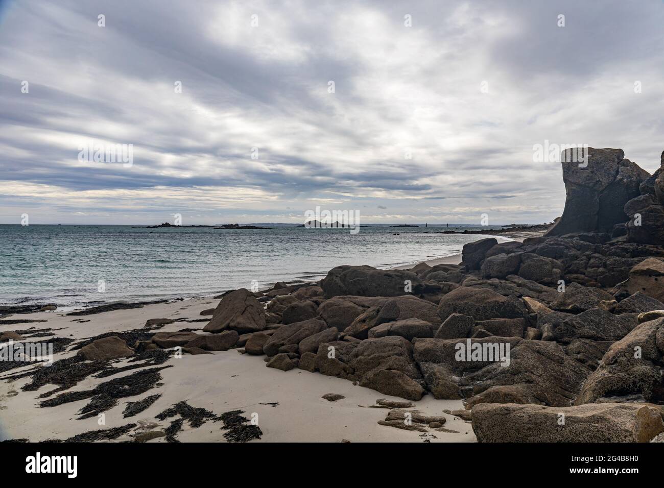 Rock on a white sand beach in Ile de Batz (Roscoff), Finistere ...