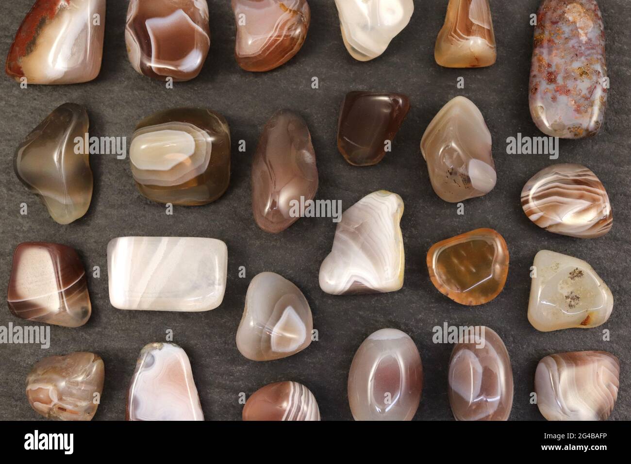 Persian agate rare jewel stones texture on black stone background Stock ...