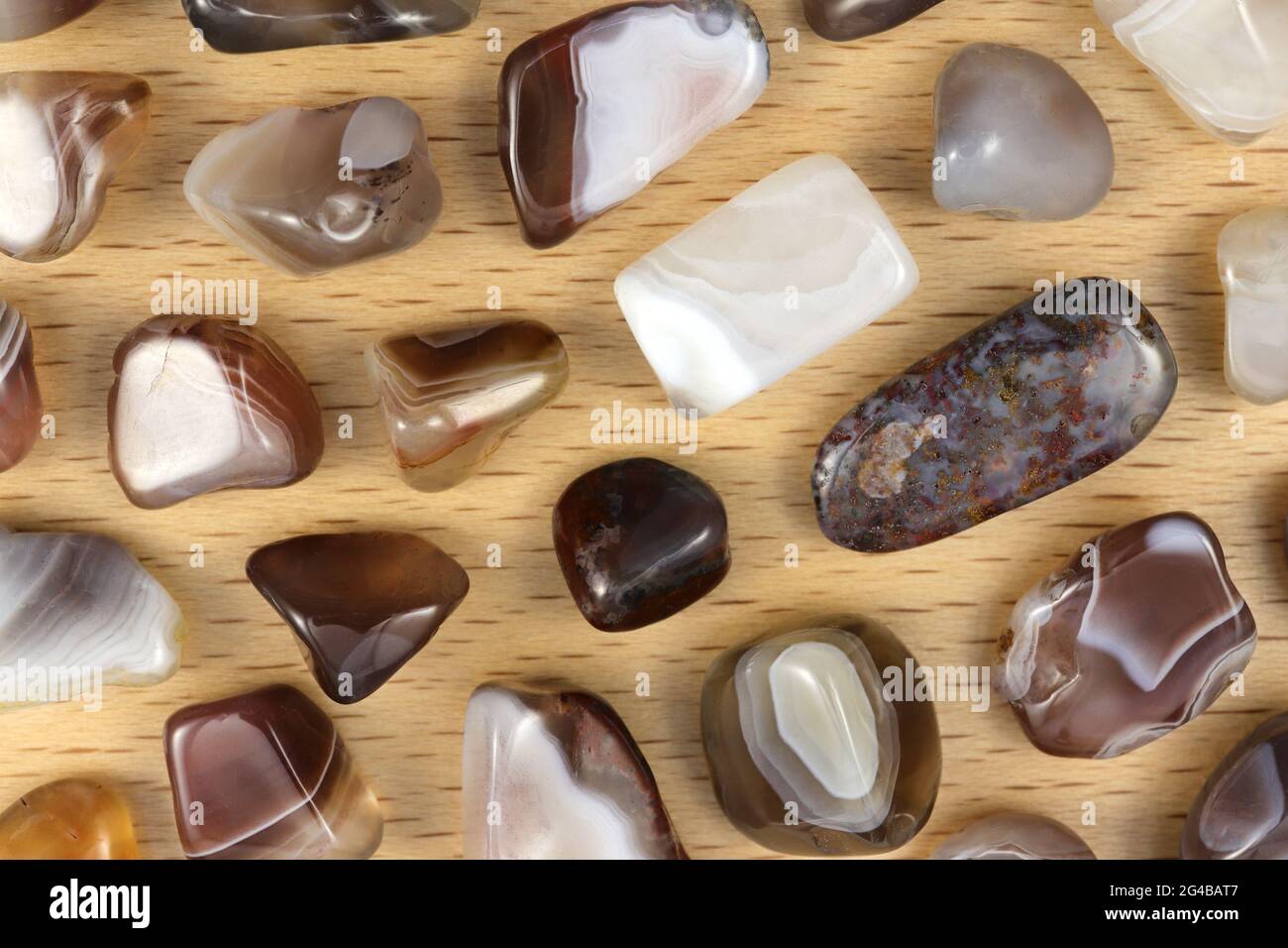 Persian agate rare jewel stones texture on light varnished wood ...