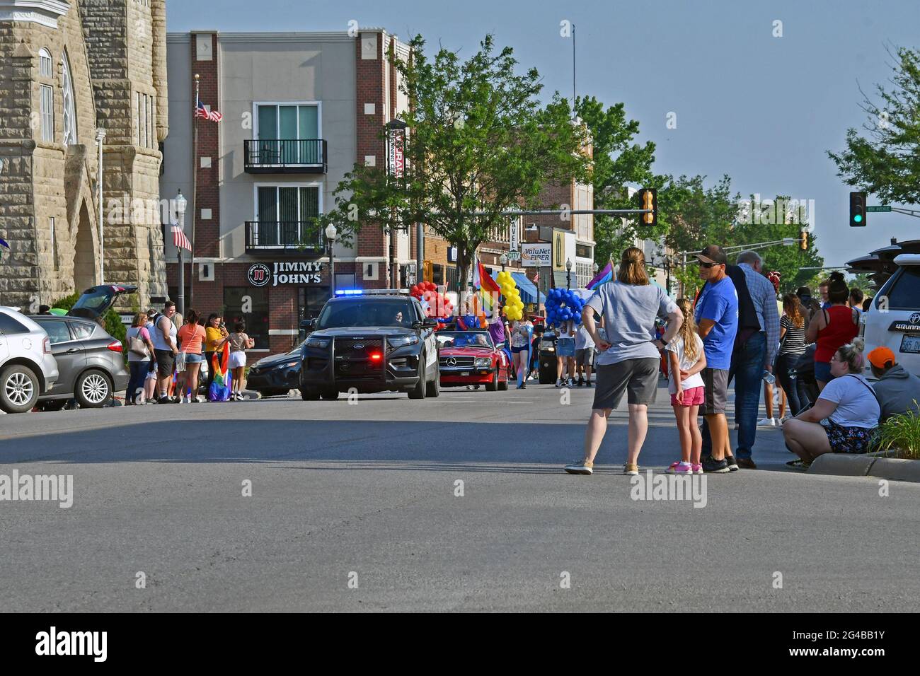 Local residents stand along Commercial street to view the first ever ...