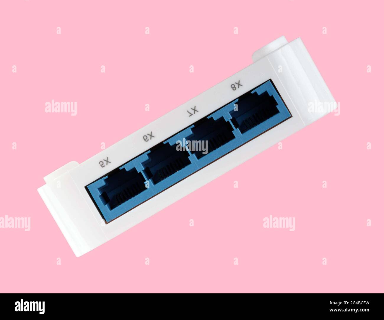 White 8 Port Plastic Ethernet Switch isolated on pink background at dry ...