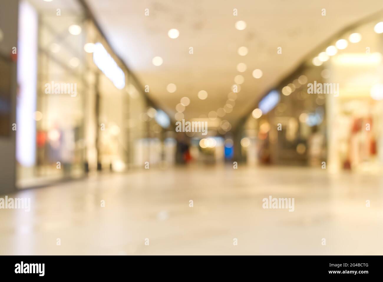 shopping mall blurred background. Light blur store interior with bokeh ...