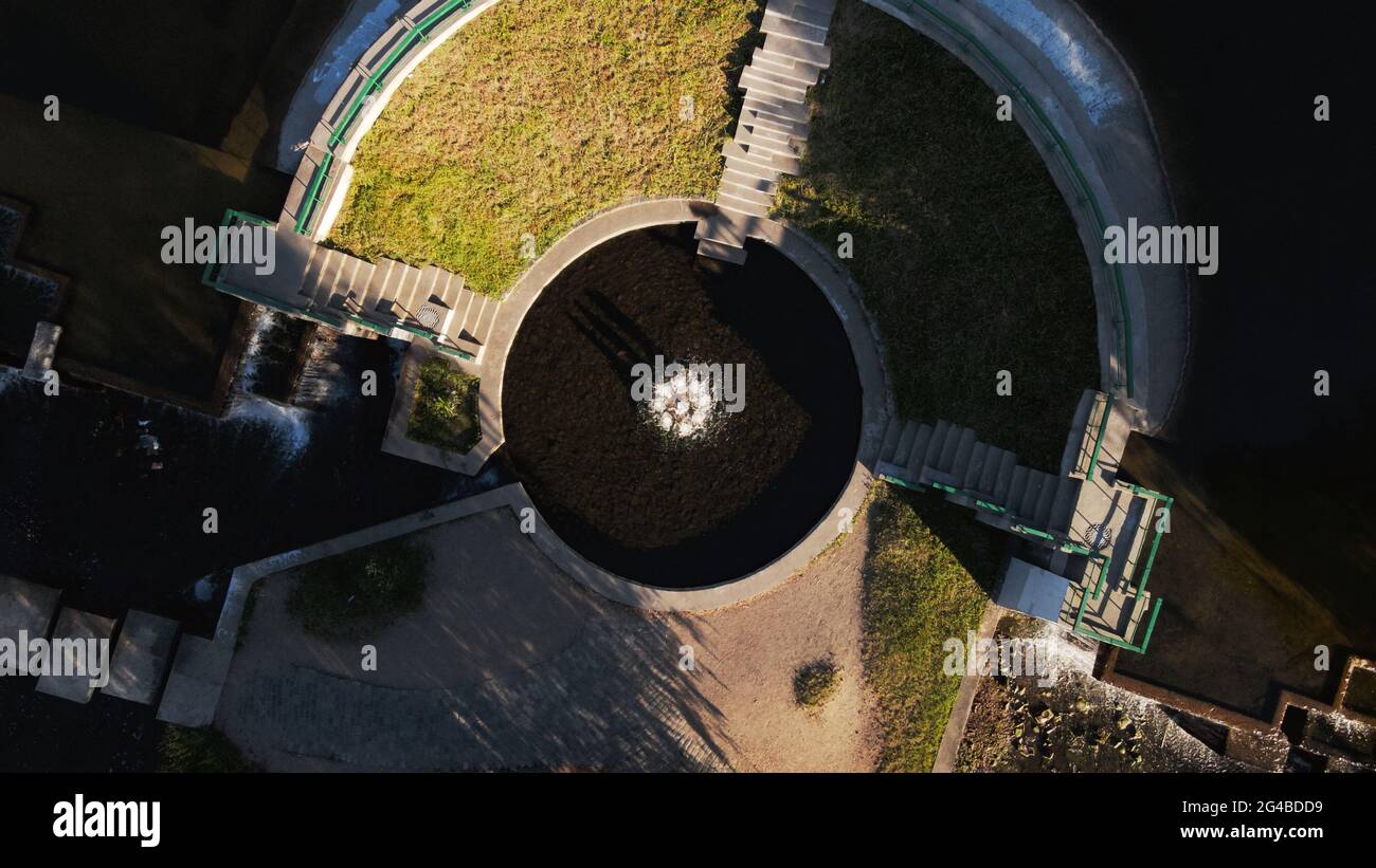 Urban water system. The river flowing in the city. With fountains and ...