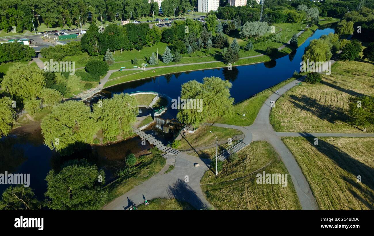 Urban water system. The river flowing in the city. With fountains and ...