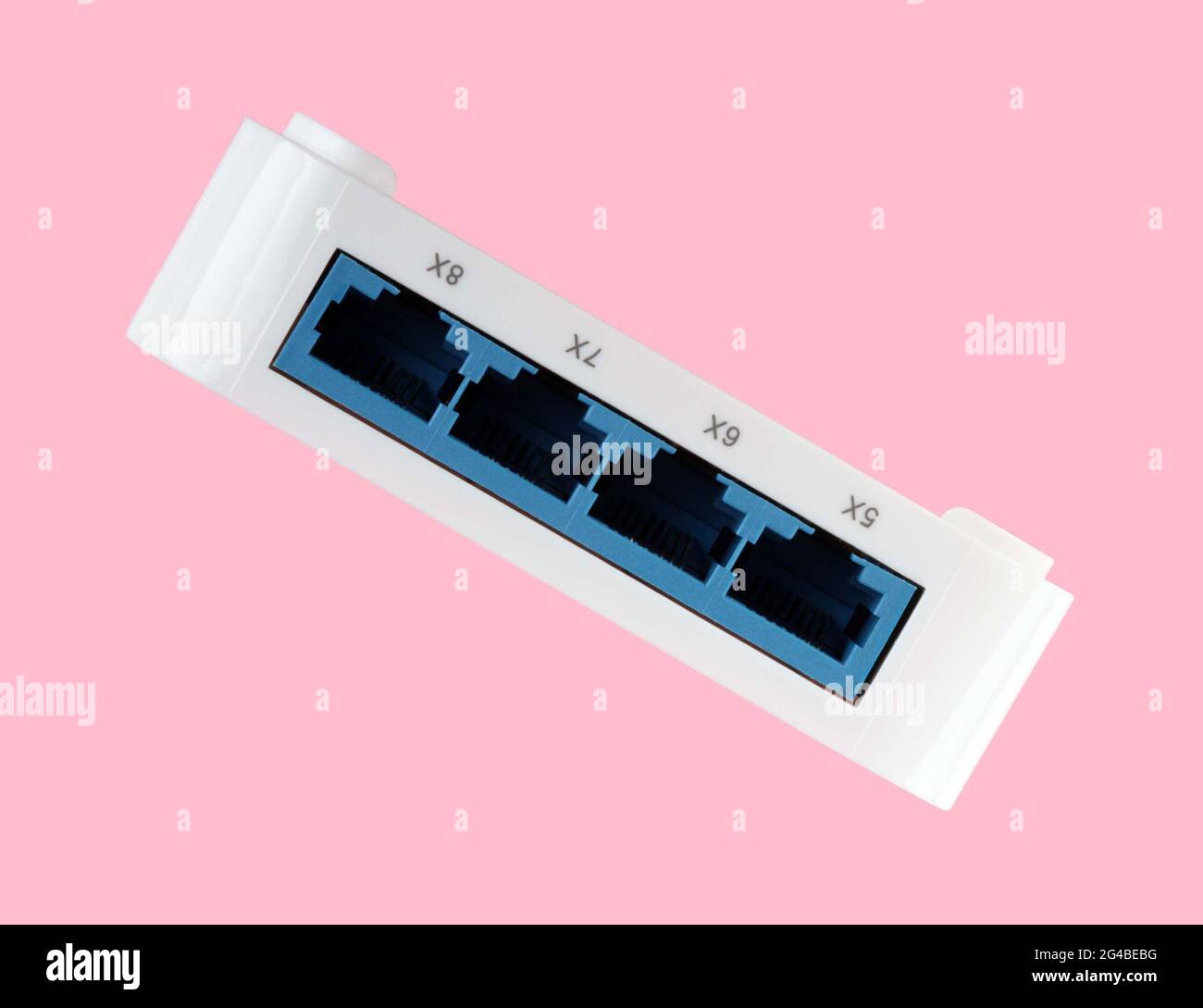 White 8 Port Plastic Ethernet Switch isolated on pink background at dry ...