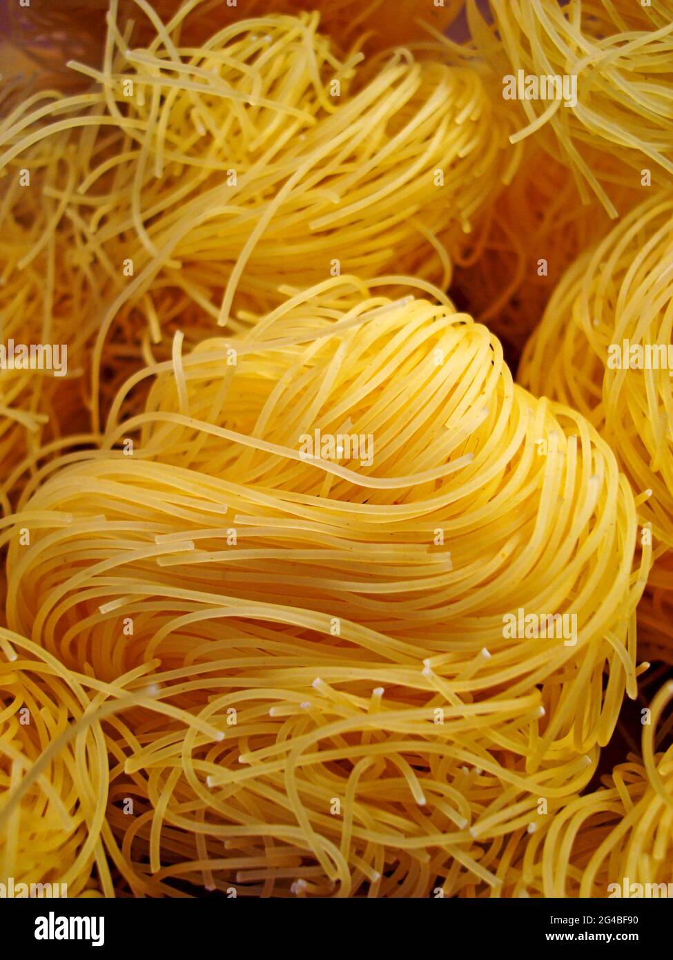 Raw italian pasta in the kitchen Stock Photo - Alamy