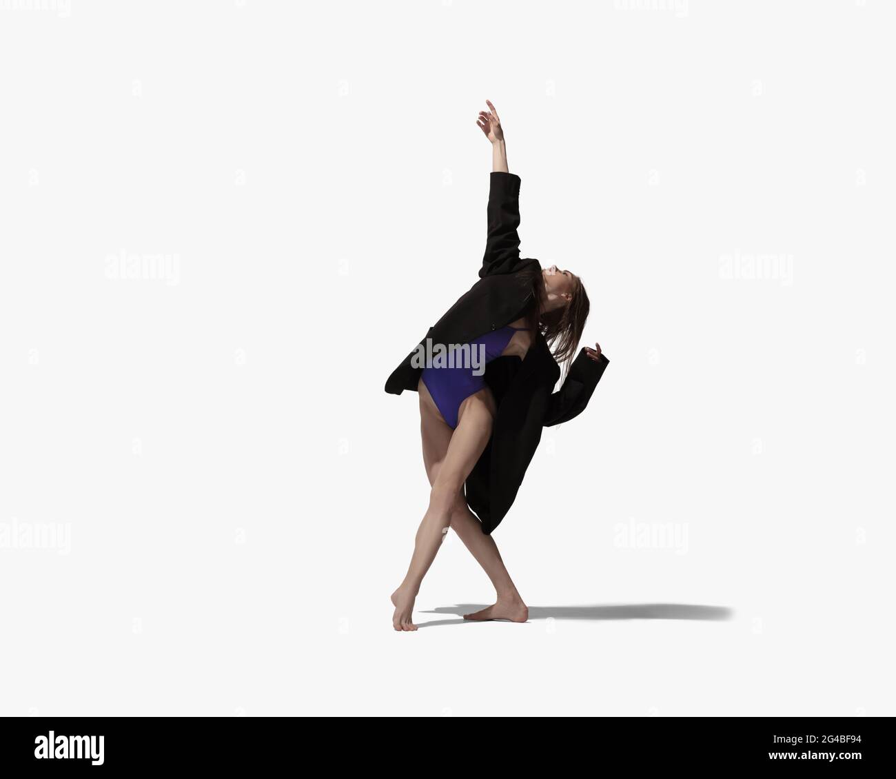 Solo. Young beautiful girl, female ballet dancer dancing isolated over ...