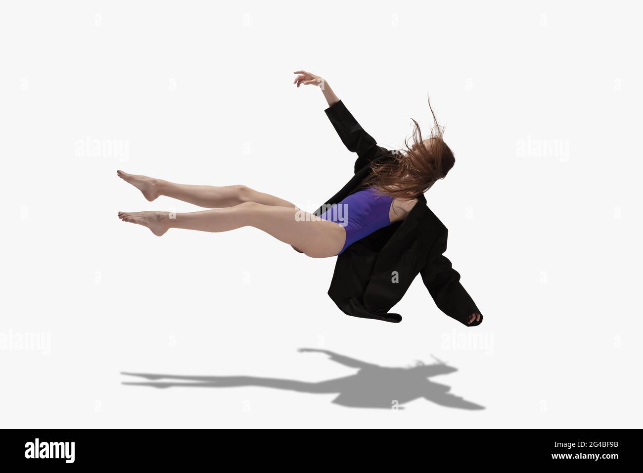 Young beautiful girl, female ballet dancer dancing isolated over white ...