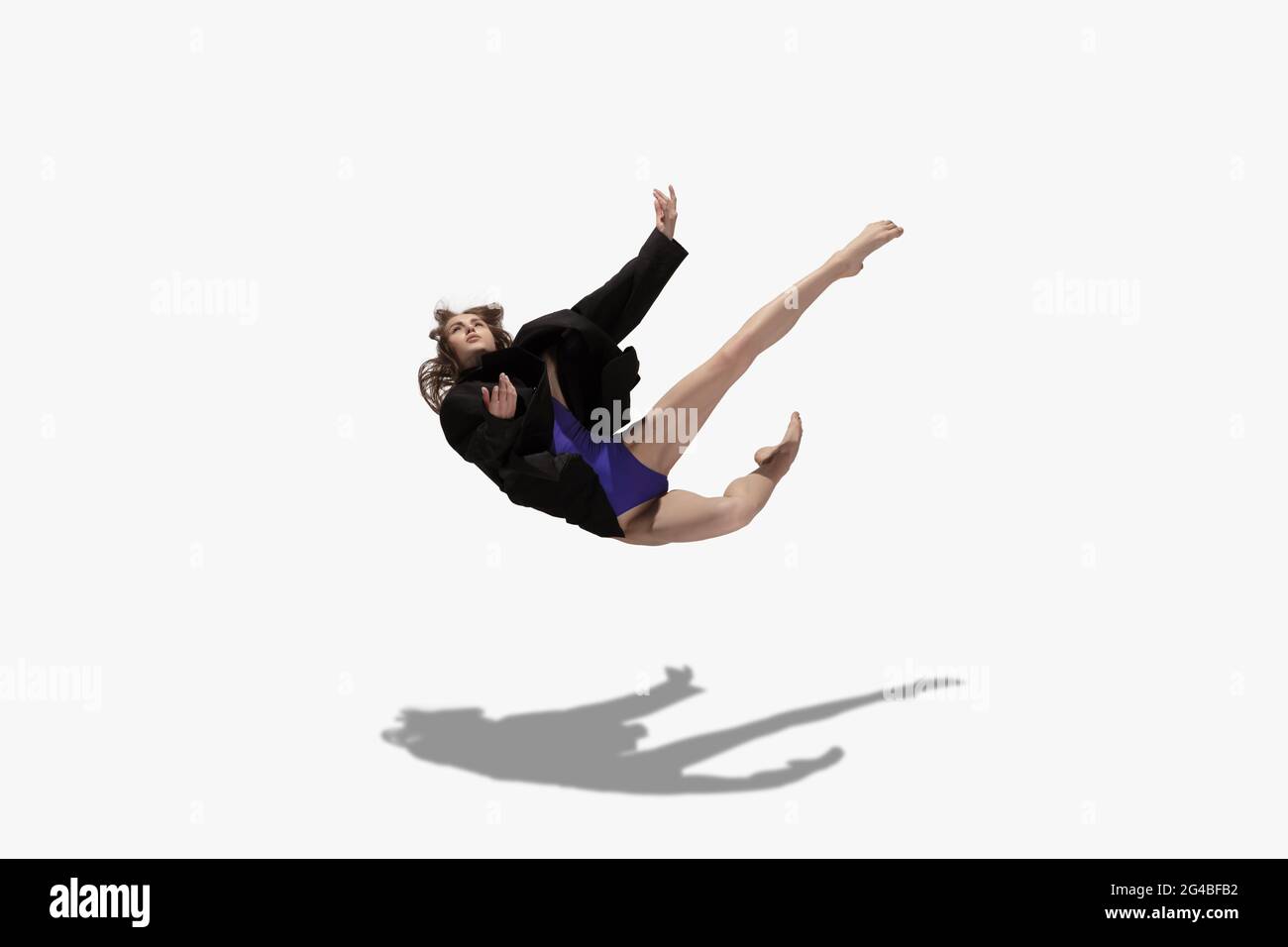 Flying. Young beautiful girl, female ballet dancer dancing isolated ...