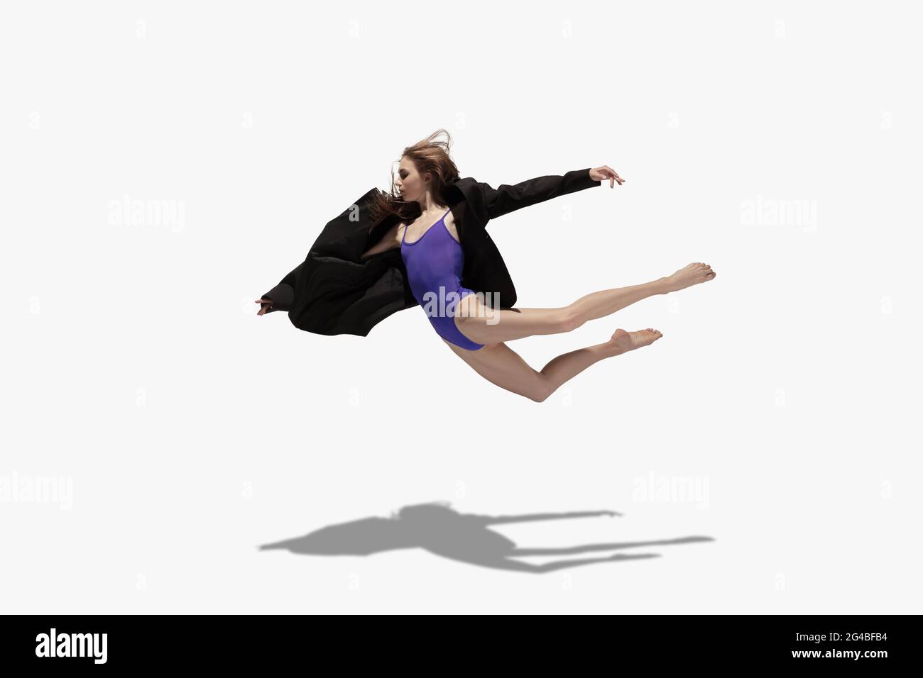 Soar up. Young beautiful girl, female ballet dancer dancing isolated ...