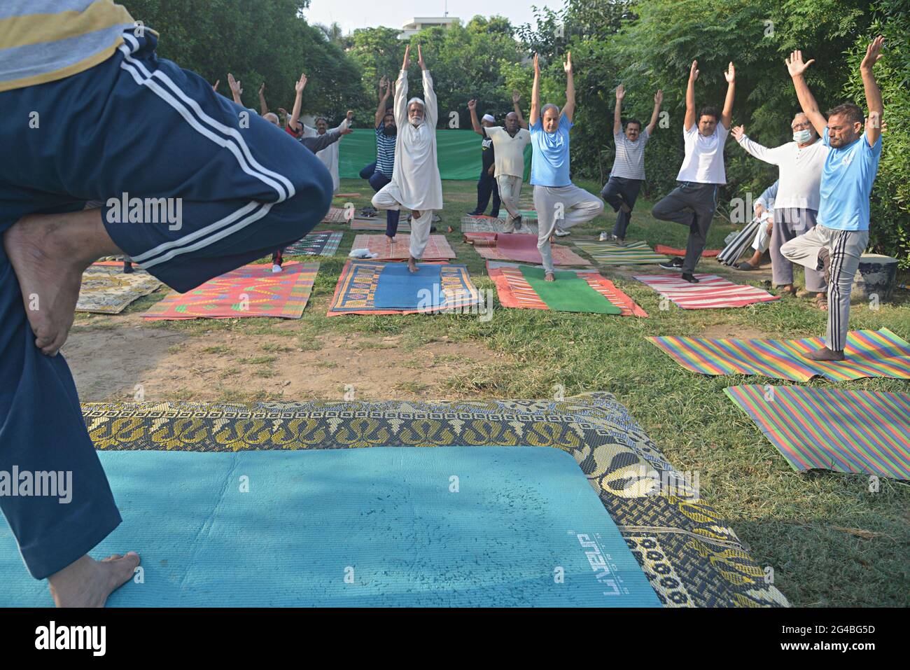 Pakistani people performing yoga session at the historical Shalimar ...