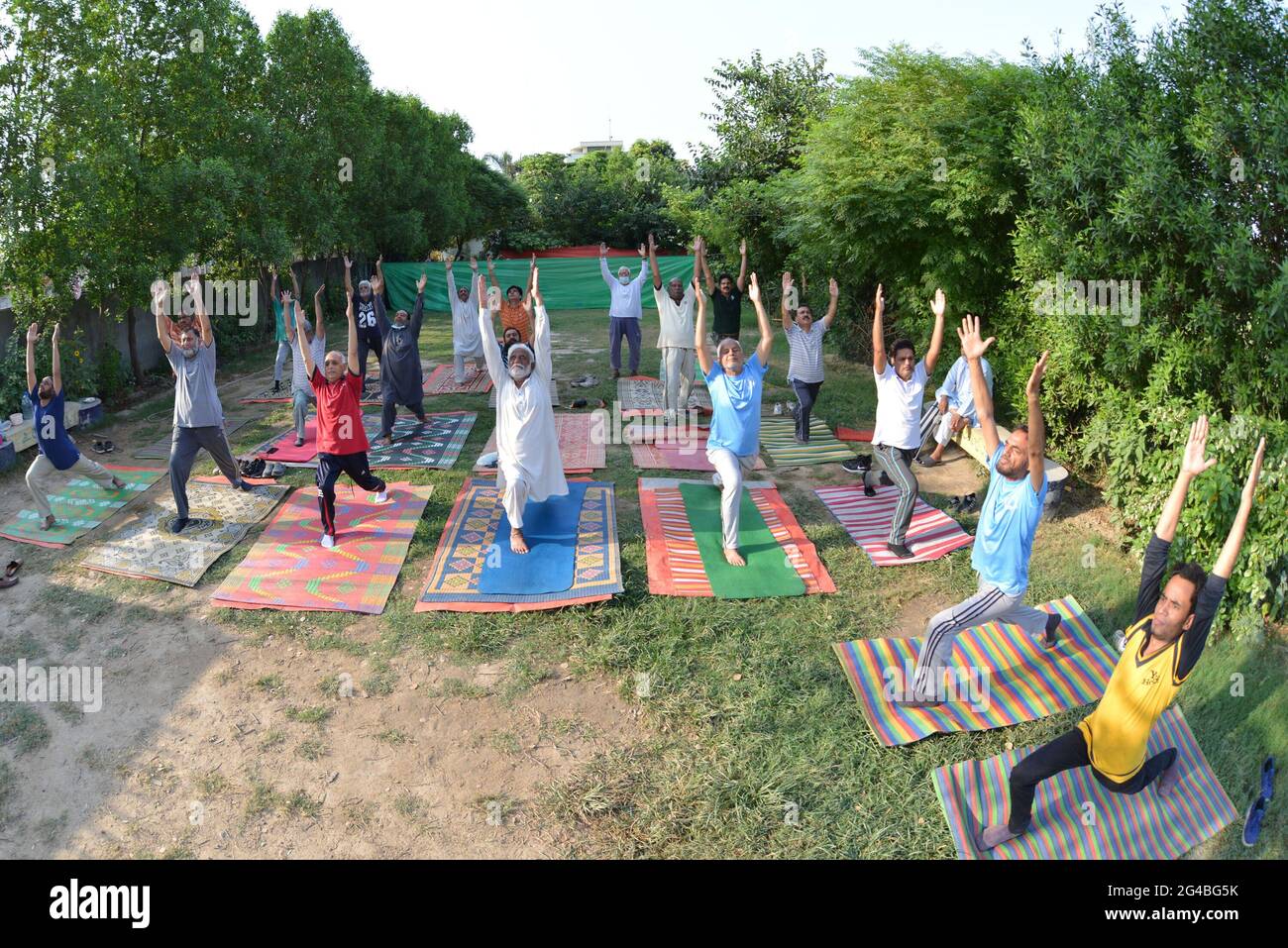 Pakistani people performing yoga session at the historical Shalimar ...