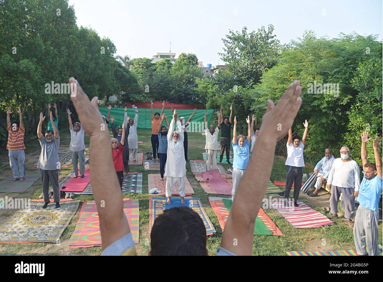 Pakistani people performing yoga session at the historical Shalimar ...