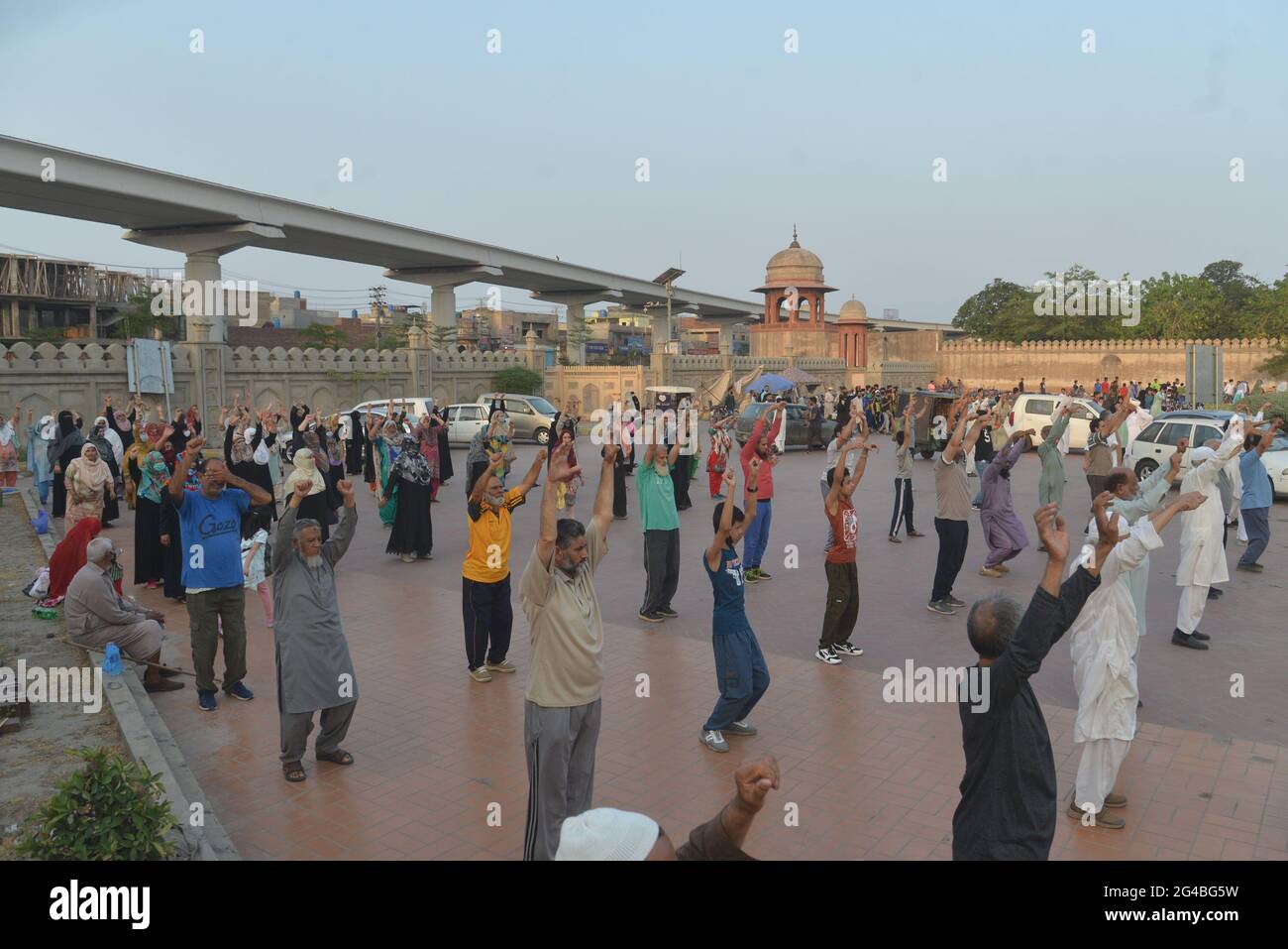 Pakistani people performing yoga session at the historical Shalimar ...