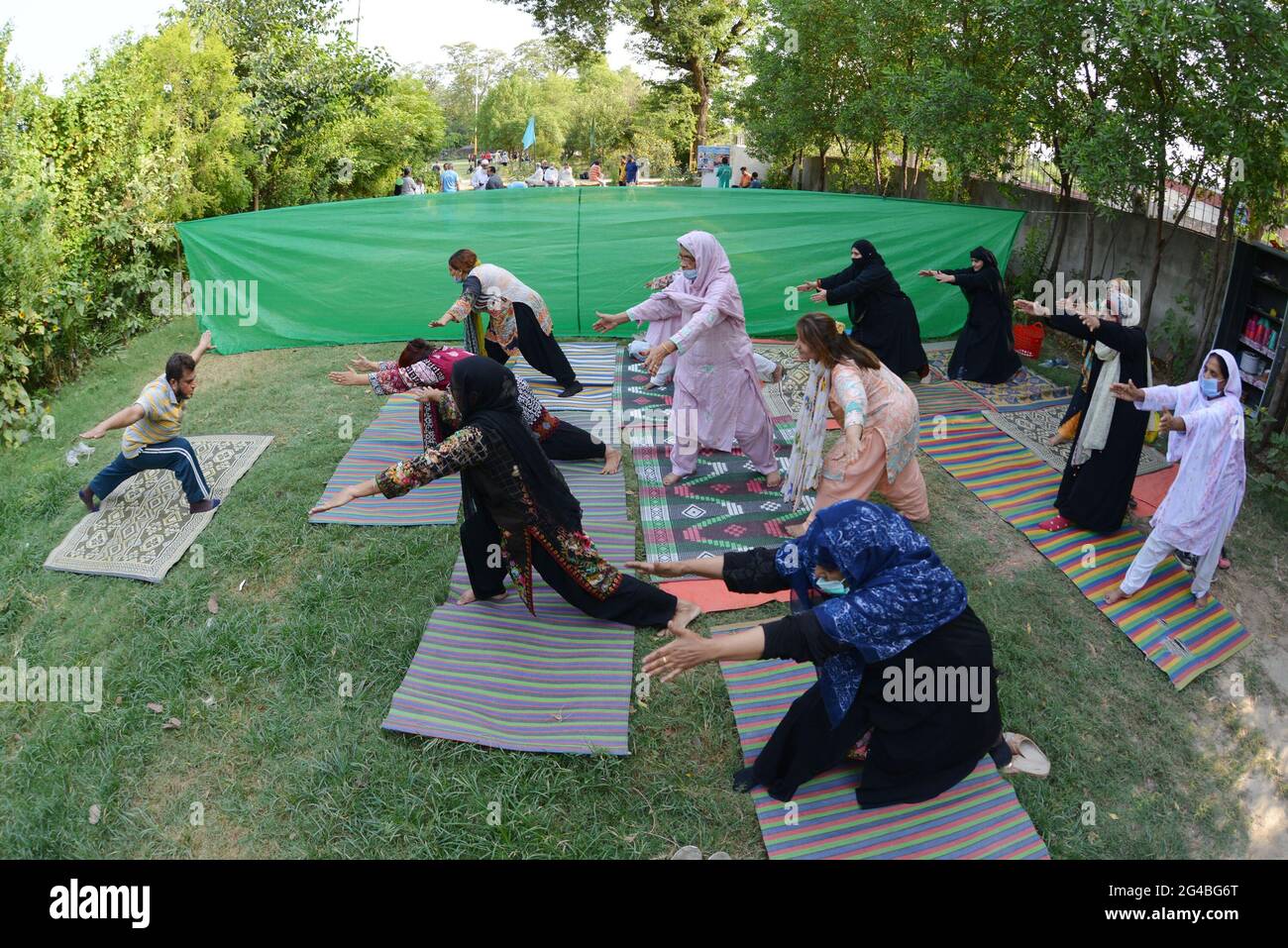 Pakistani people performing yoga session at the historical Shalimar ...