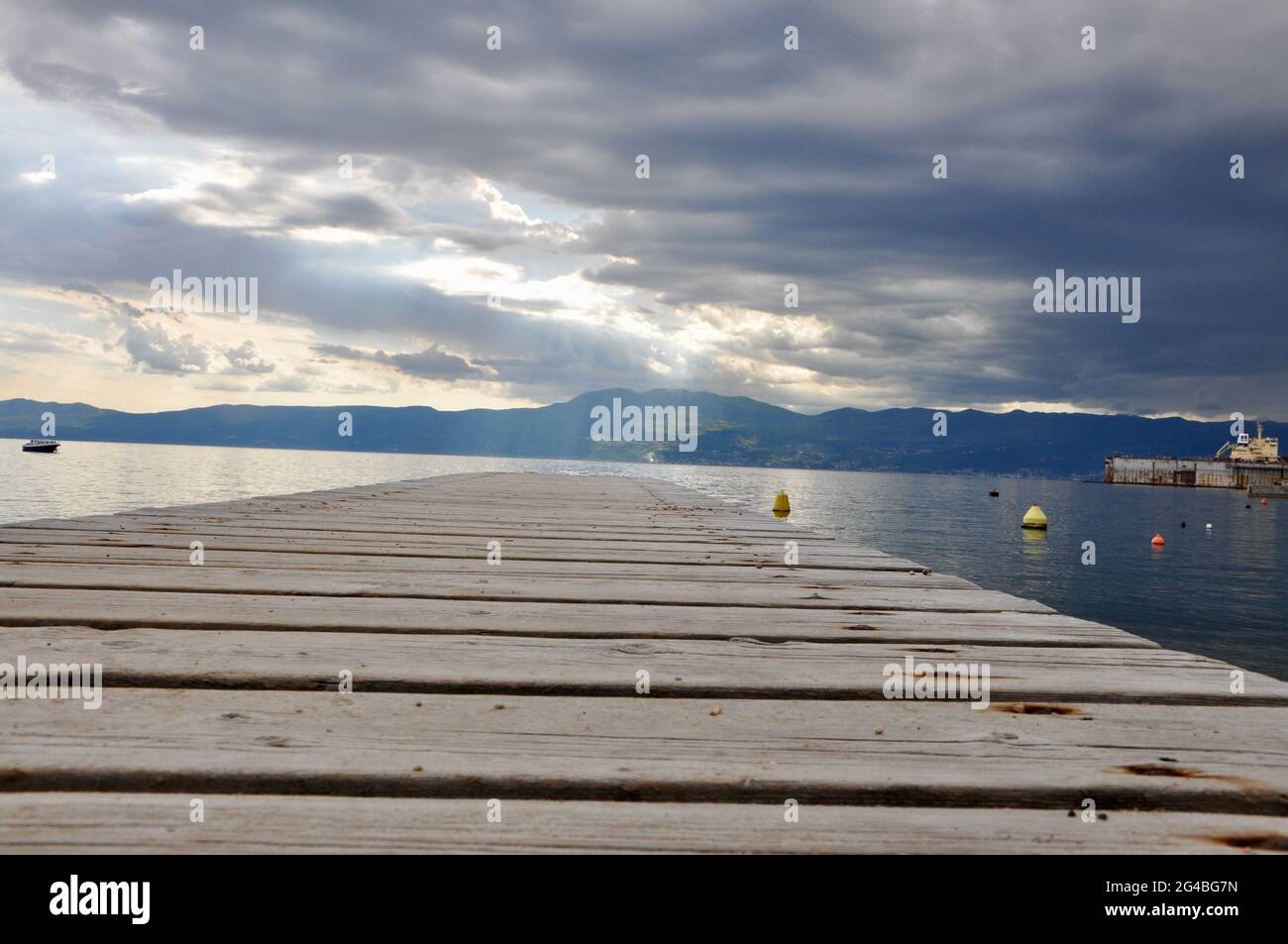 Empty wood deck pier with sea ocean view. Idyllic arbor on water ...
