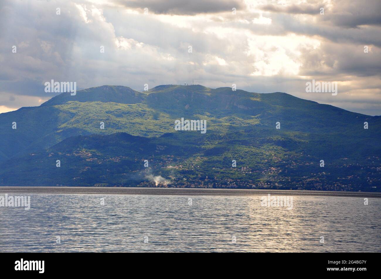 Panoramic view of the Ucka mountain from the sea. Sun rays over the ...