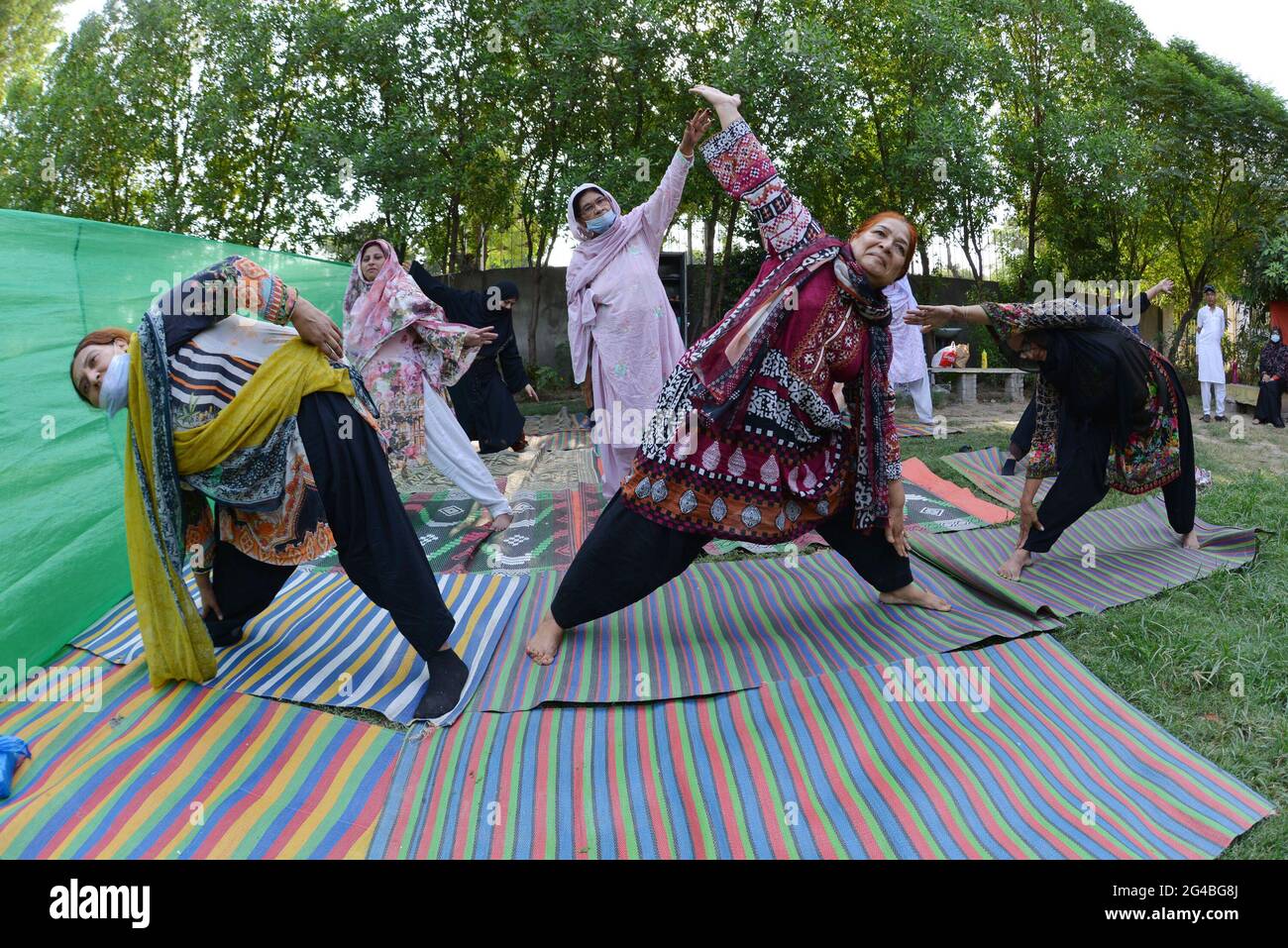 Pakistani people performing yoga session at the historical Shalimar ...