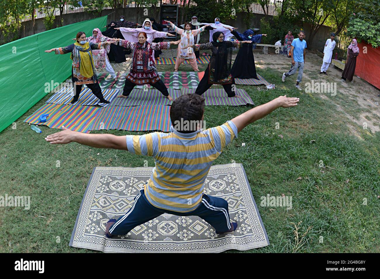 Pakistani people performing yoga session at the historical Shalimar ...