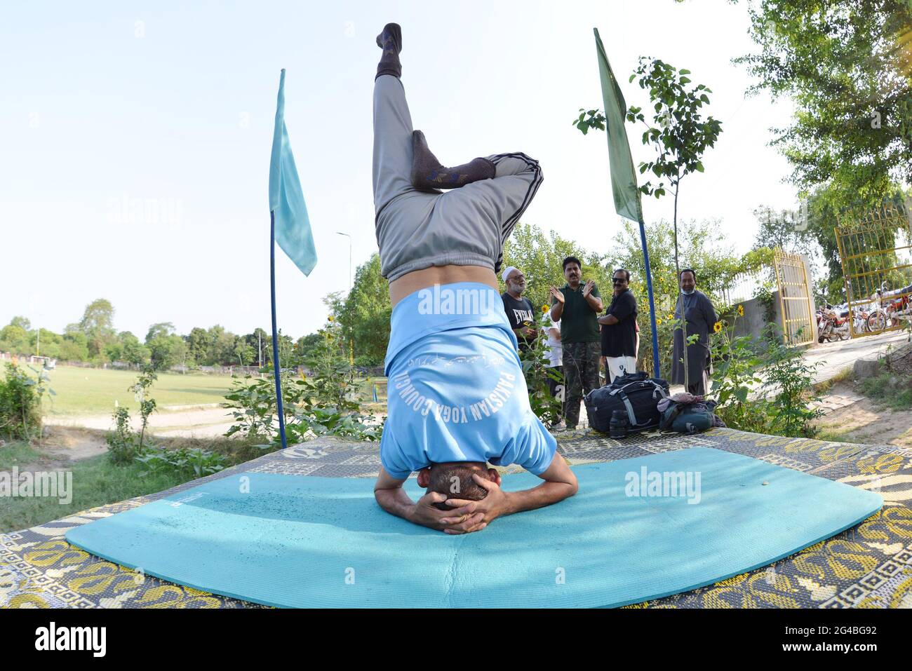 Pakistani people performing yoga session at the historical Shalimar ...