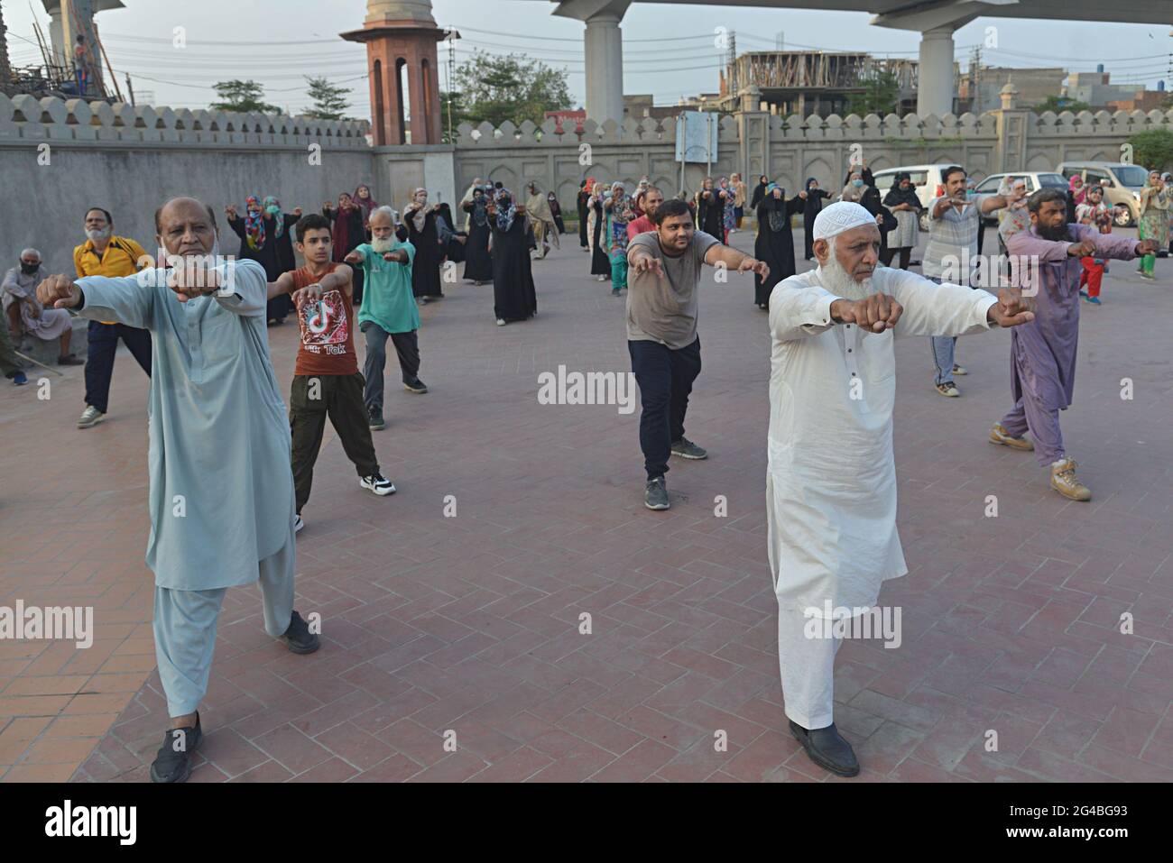 Pakistani people performing yoga session at the historical Shalimar ...