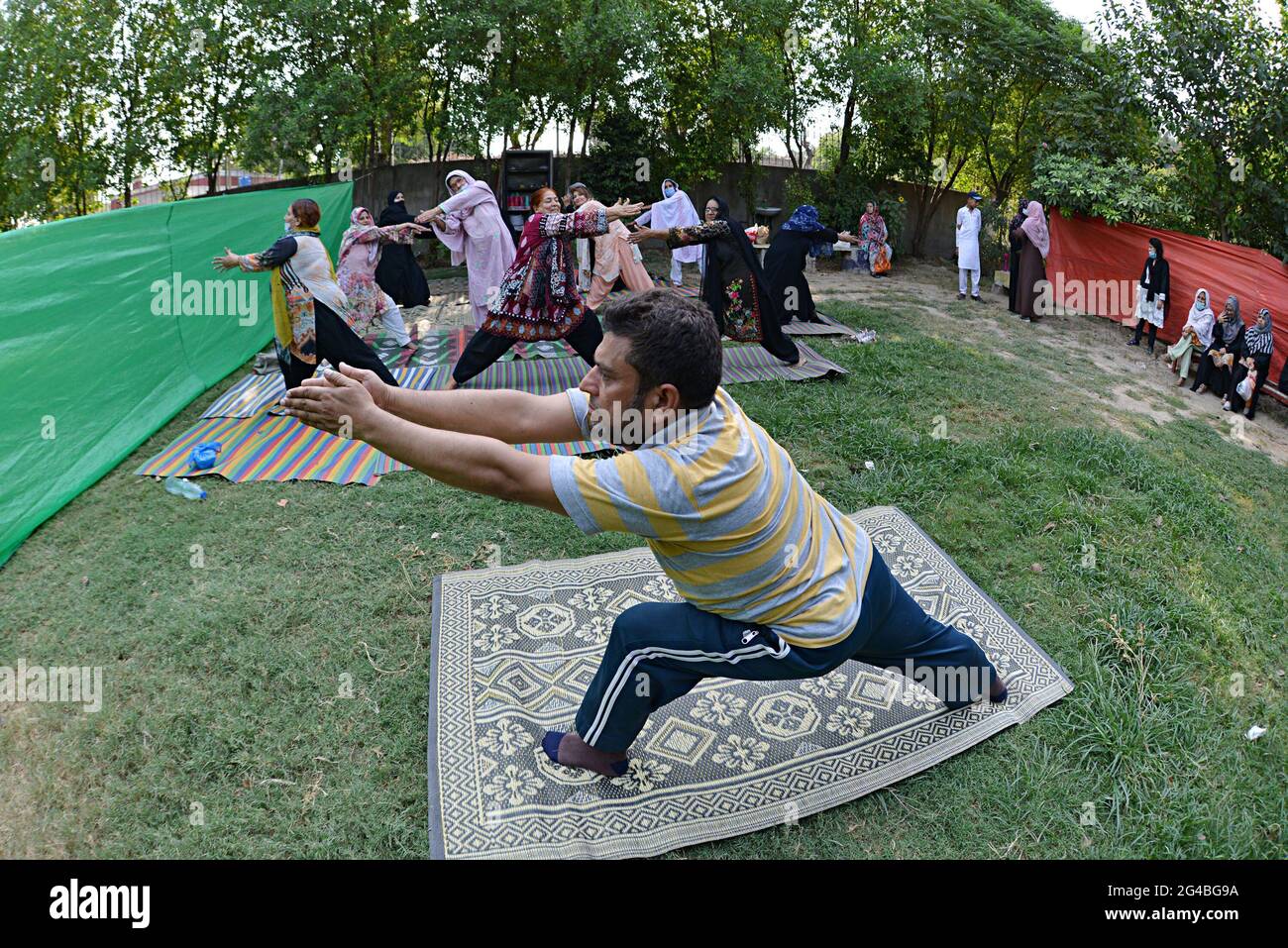 Pakistani people performing yoga session at the historical Shalimar ...