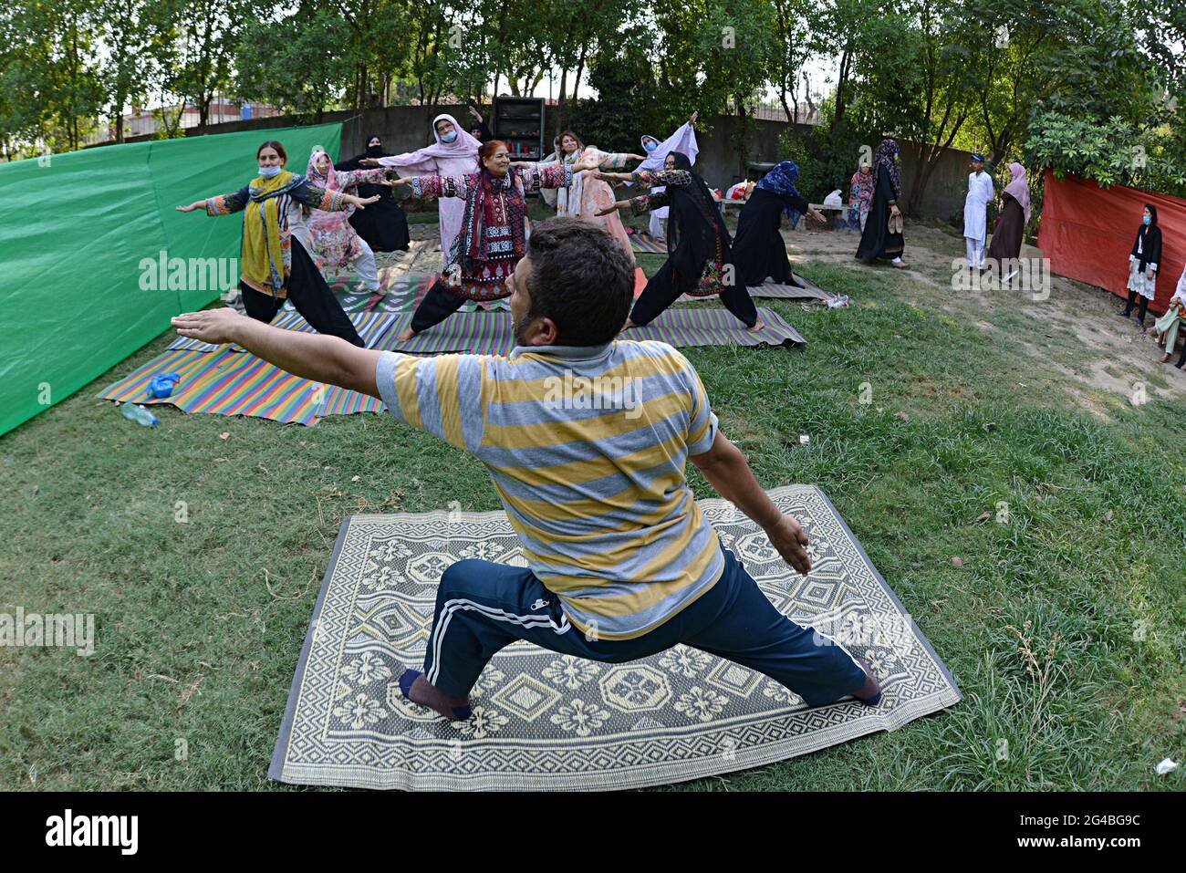 Pakistani people performing yoga session at the historical Shalimar ...